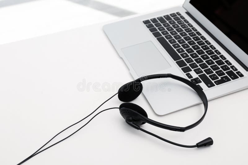Modern Laptop and Headset on Table Stock Photo - Image of problems ...