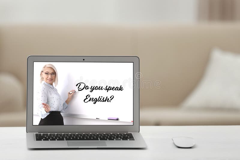 Laptop for Online English Learning with Teacher on Table Indoors Stock ...