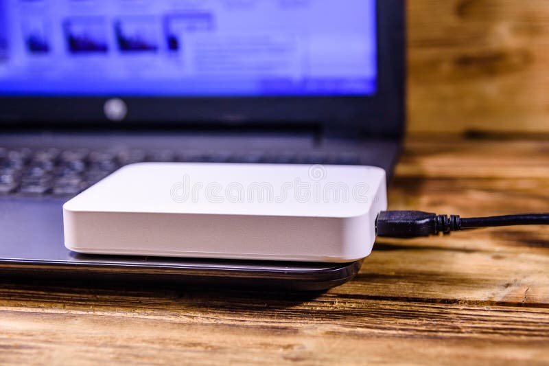 Modern Laptop and Ssd Hard Drive on a Wooden Desk Stock Image - Image ...