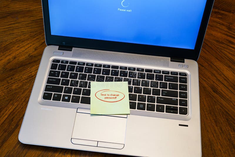 Change of Password To a Stronger One. Message on Sticky Note on Laptop ...