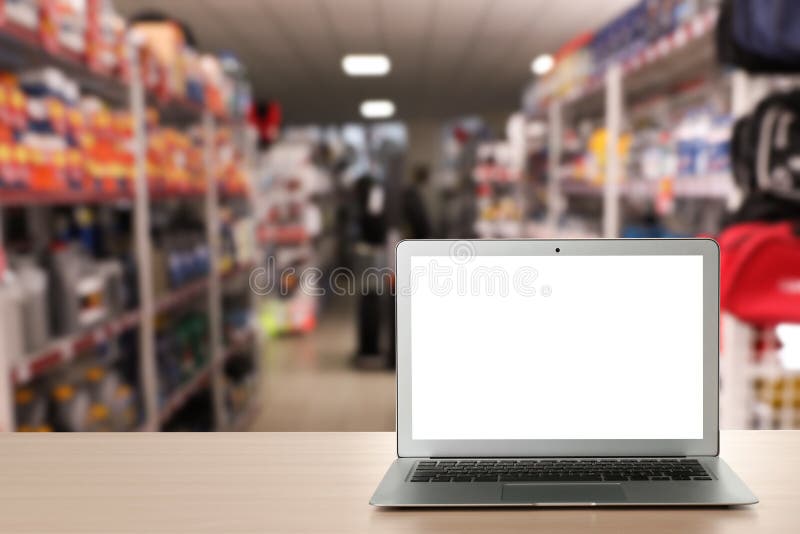 Modern Laptop on Table in Auto Store Stock Photo - Image of equipment ...