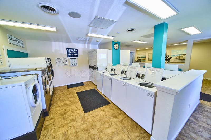 Modern Laundromat with Open Washers and Dryers Eye-Level View Stock ...