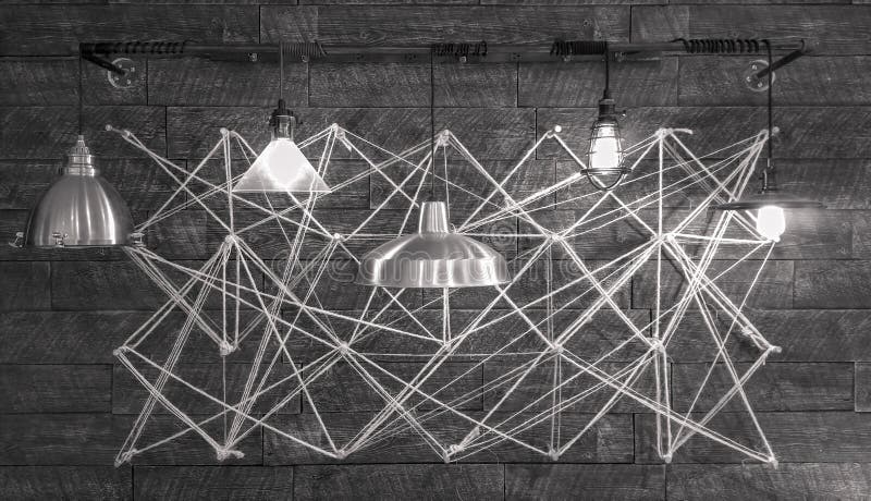 Modern Light Fixtures Hanging in Front of Complex Geometrical Design ...