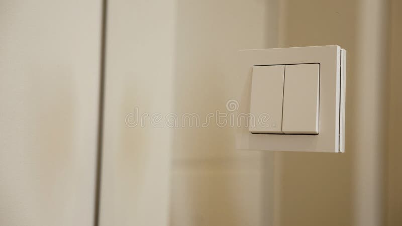 Modern Light Switch Mounted on a White Wall. Stock Photo - Image of ...