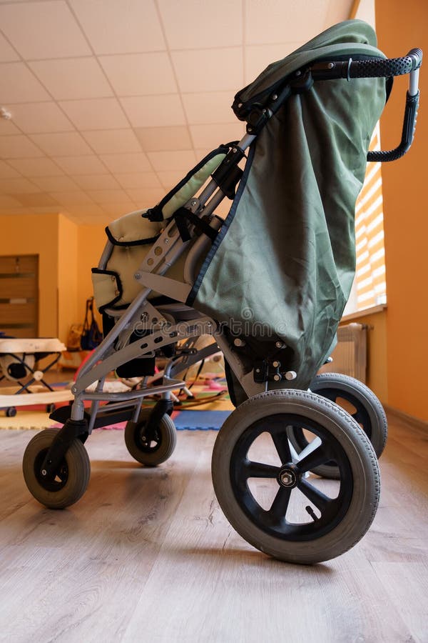Modern Lightweight Stroller in a Bright Indoor Playroom Stock Photo ...