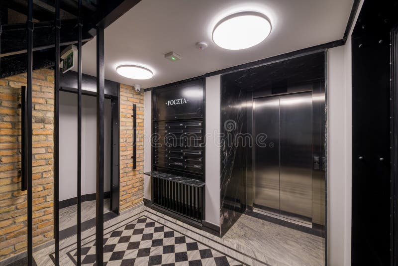 Modern Lobby with Brick Wall and Elevator Stock Image - Image of ...
