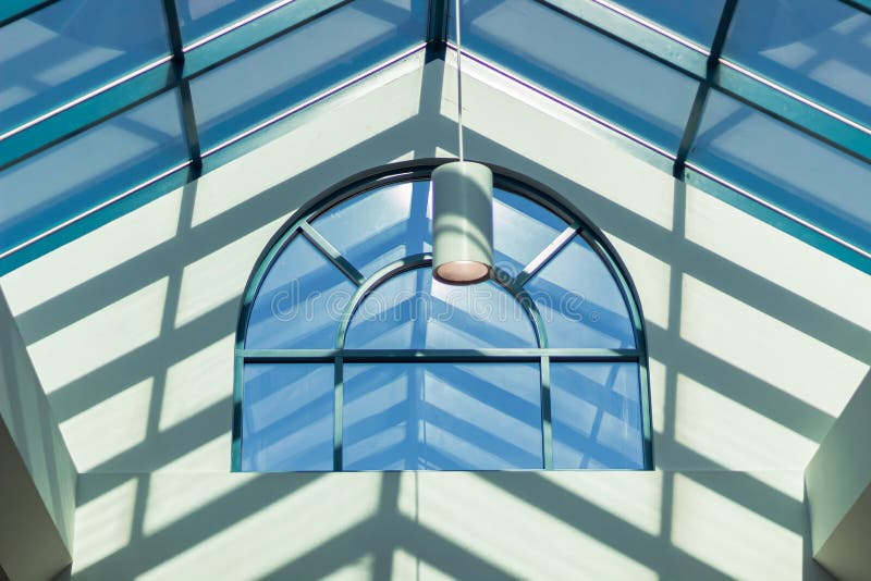 Modern Loft Interior Design. Sun Rays and Big Arch Window Stock Image ...