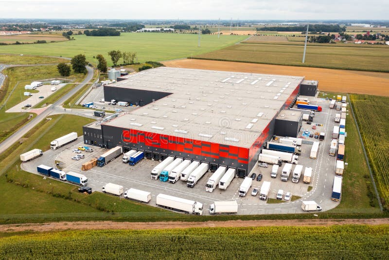Modern Logistics Center and Many Trucks Awaiting Unloading. Warehouses ...