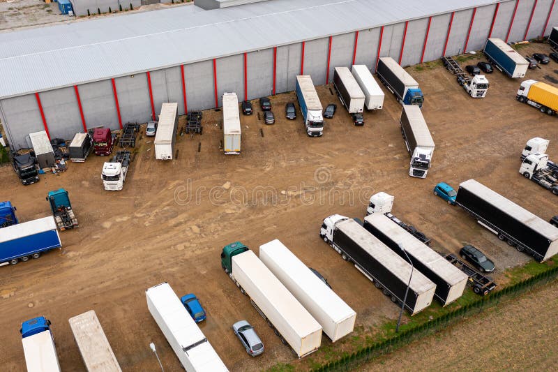 Modern Logistics Center and Many Trucks Awaiting Unloading. Warehouses ...