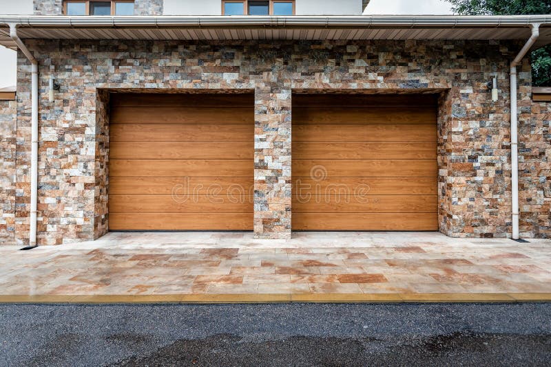 Modern and Luxurious Double Garage with Driveway and Roller Door Stock ...