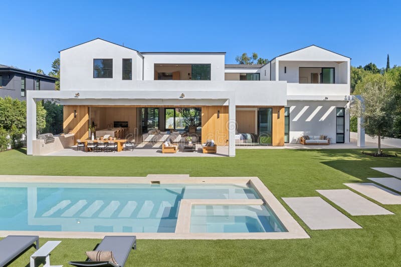 Modern Luxury Home with Pool and Spacious Backyard. Stock Photo - Image ...