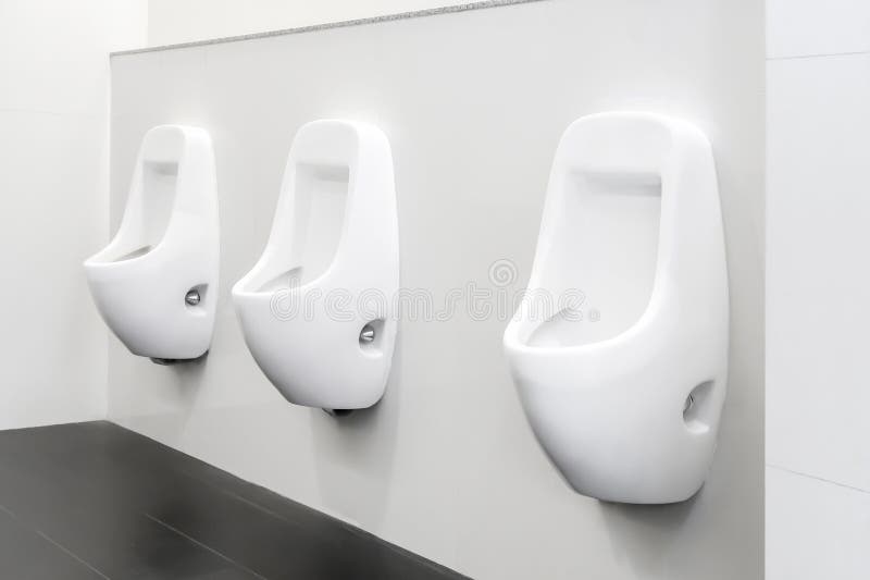 Modern and Luxury Male Urinals on the White Wall Stock Photo - Image of ...