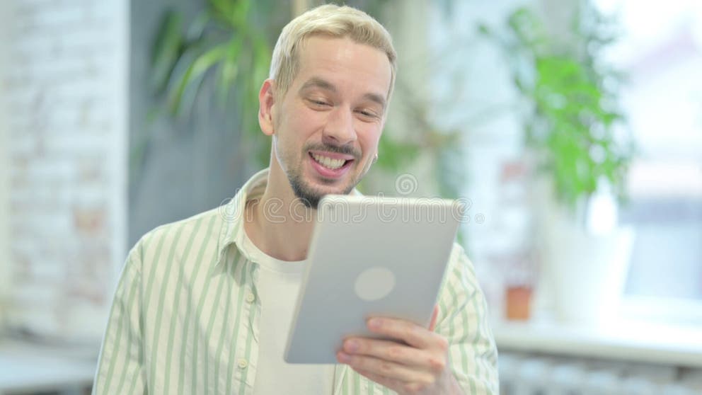 Modern Young Man Browsing Internet on Tablet Stock Photo - Image of ...