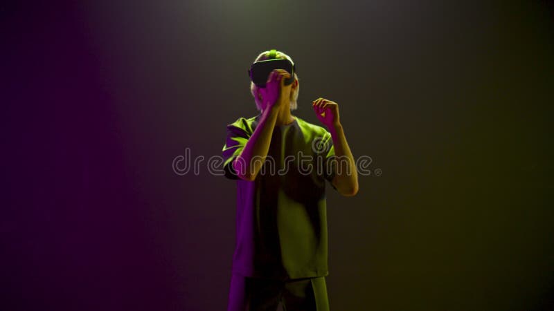 Modern Man Dancing in Vr Glasses at Neon Light. Guy Playing Cyber ...