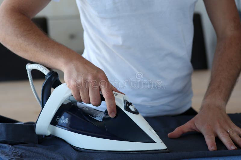 Modern Man Doing the Ironing Stock Photo - Image of feminism, indoors ...