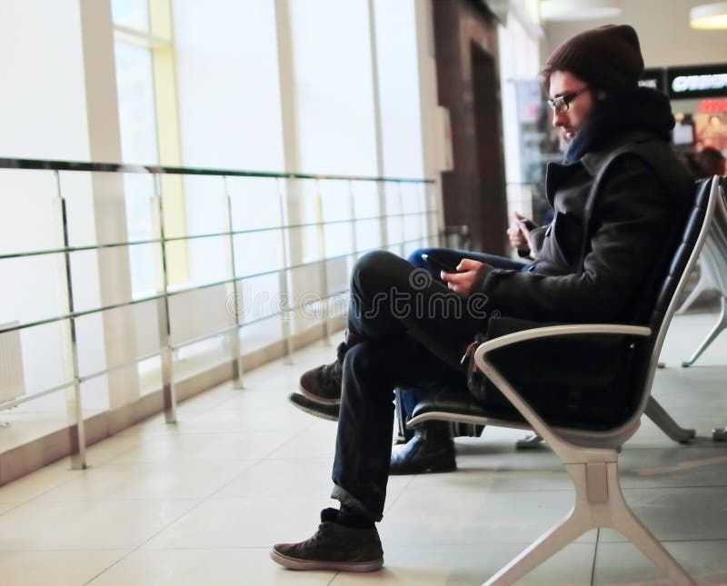 Modern Man with a Laptop Sitting at the Airport Stock Photo - Image of ...