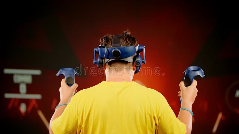 The Modern Man Use Tracking Controllers in Her Hands, Moves Actively ...