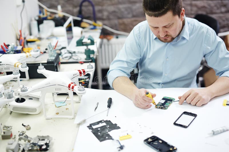 Modern Man Working in Electronics Service Shop Stock Image - Image of ...