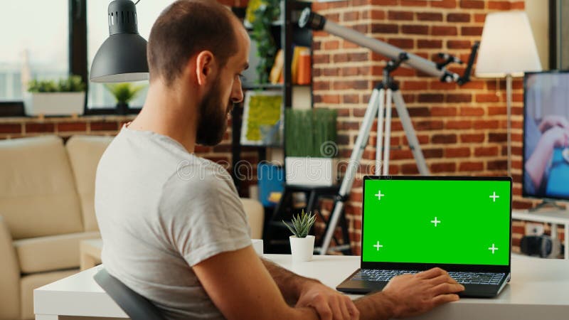 Modern Manager Looking at Laptop with Greenscreen Display Stock Image ...