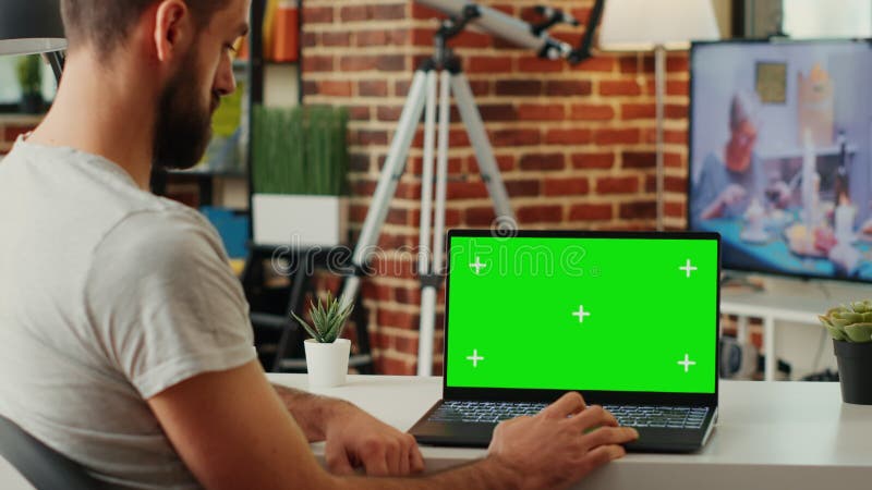 Modern Manager Looking at Laptop with Greenscreen Display Stock Video ...