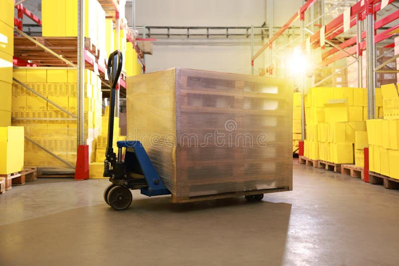 Modern Manual Forklift with Wrapped Wooden Pallets in Warehouse Stock ...