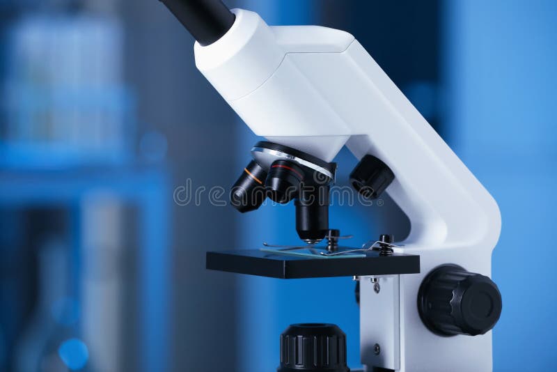 Modern Medical Microscope Against Blurred Background, Closeup Stock ...