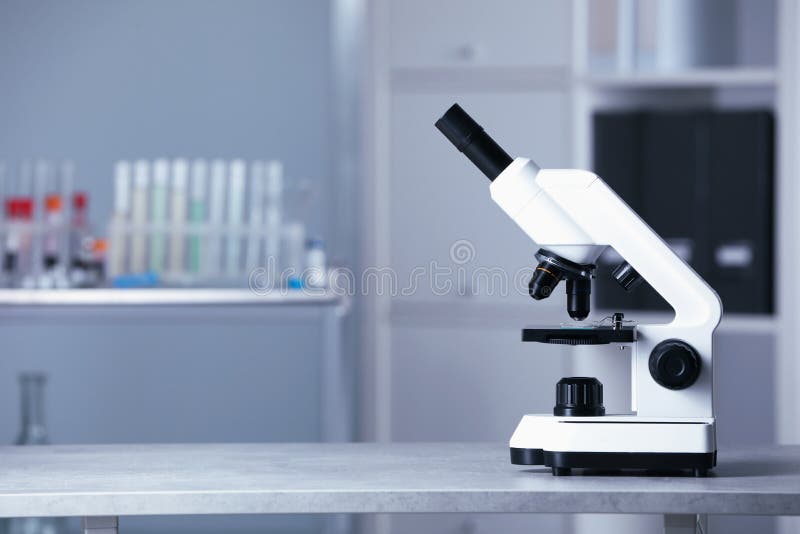 Modern Medical Microscope on Gray Table in Laboratory, Space for Text ...