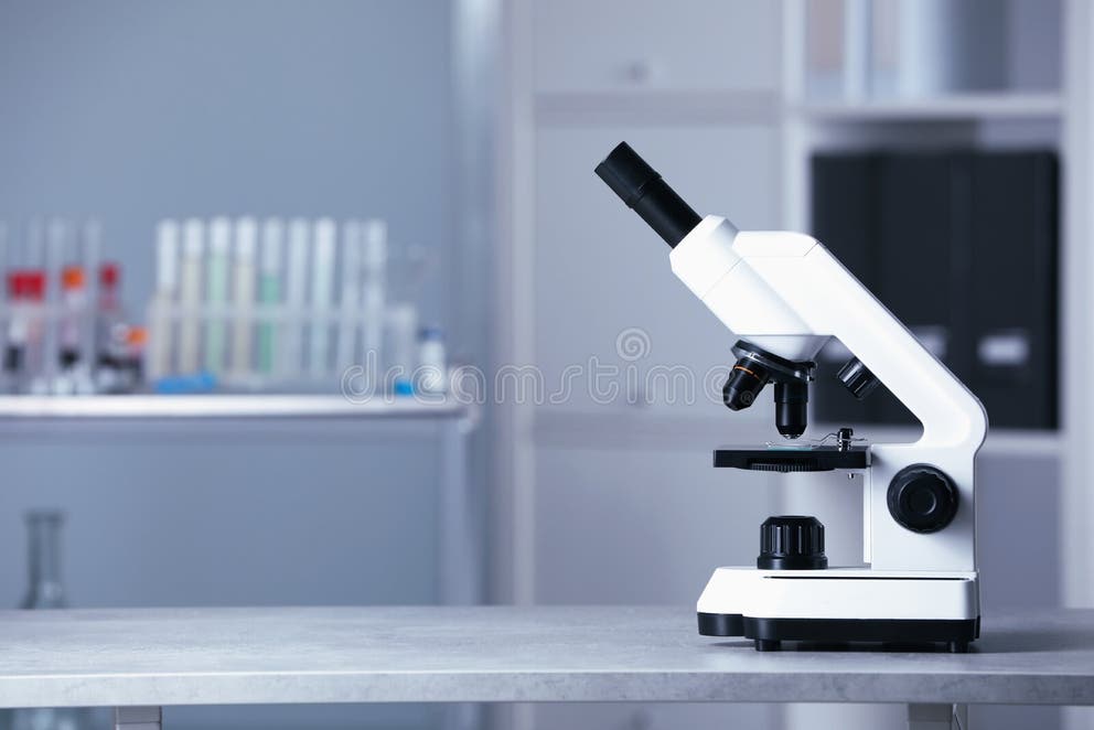 Modern Medical Microscope on Gray Table in Laboratory, Space for Text ...