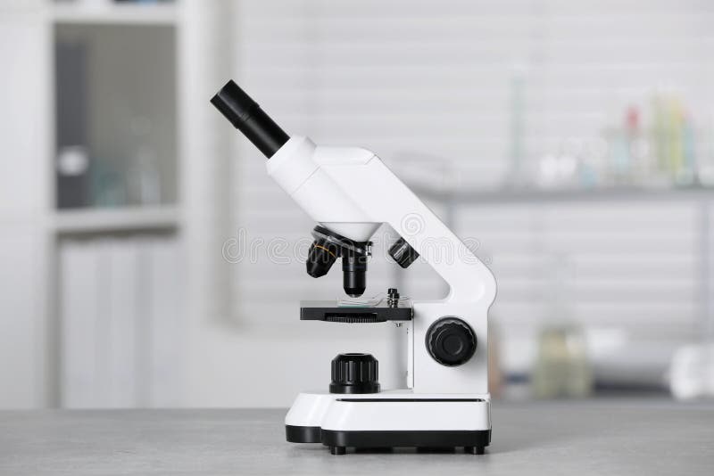 Modern Medical Microscope on Grey Table in Laboratory Stock Image ...