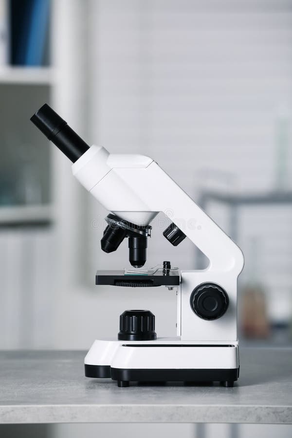 Modern Medical Microscope on Grey Table in Laboratory Stock Image ...