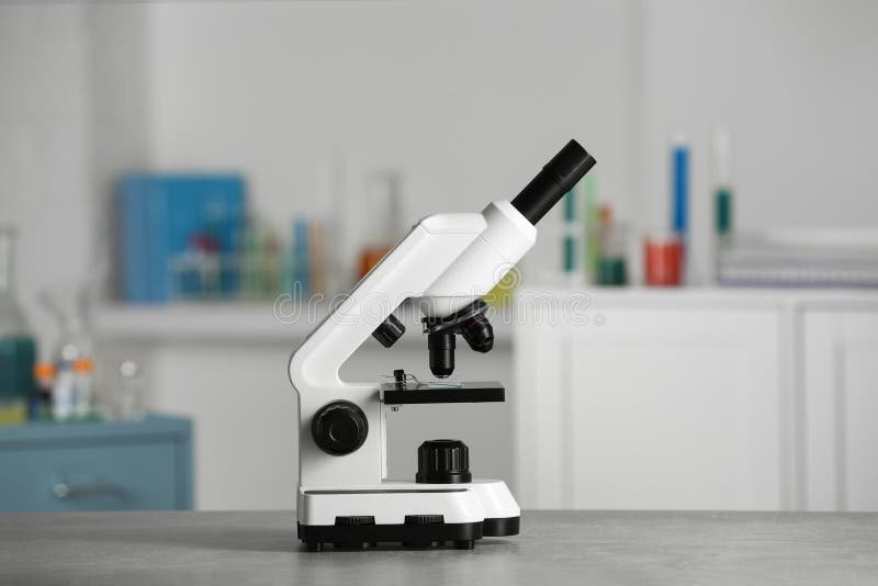 Modern Medical Microscope on Grey Table in Laboratory Stock Photo ...