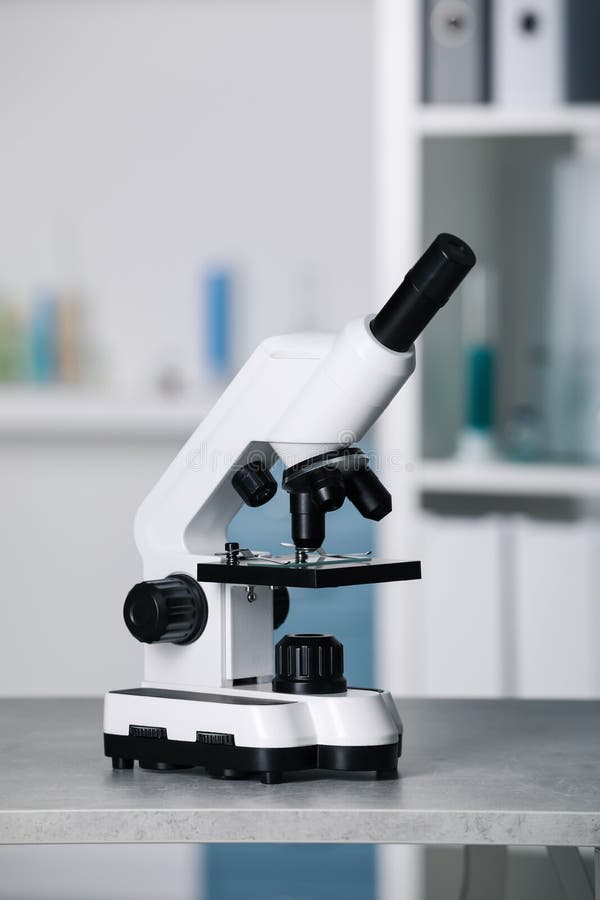 Modern Medical Microscope on Grey Table in Laboratory Stock Photo ...