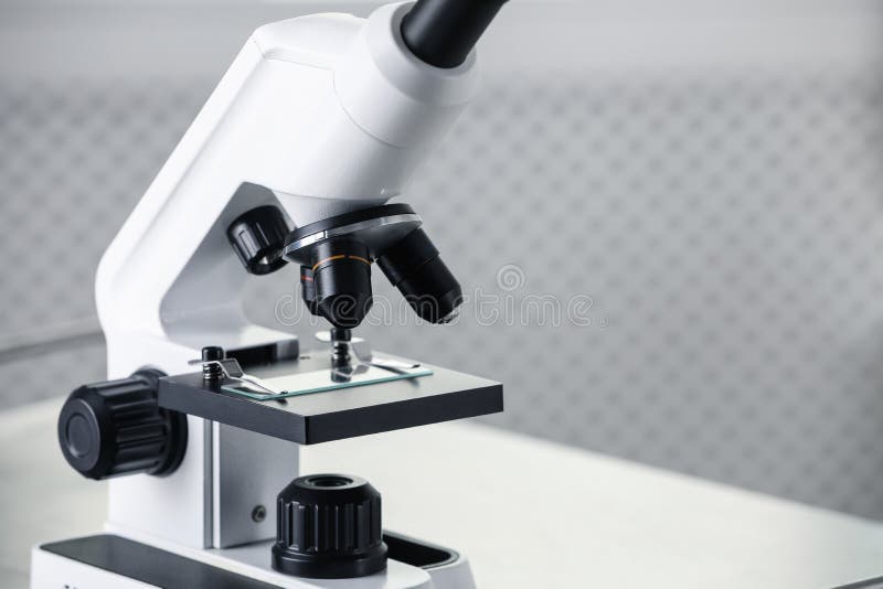 Modern Medical Microscope on Metal Table in Laboratory, Closeup. Space ...