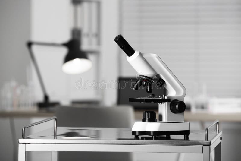Modern Medical Microscope on Metal Table in Laboratory, Space for Text ...