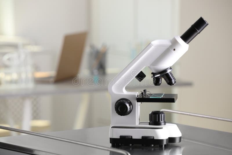 Modern Medical Microscope on Metal Table in Laboratory, Space for Text ...