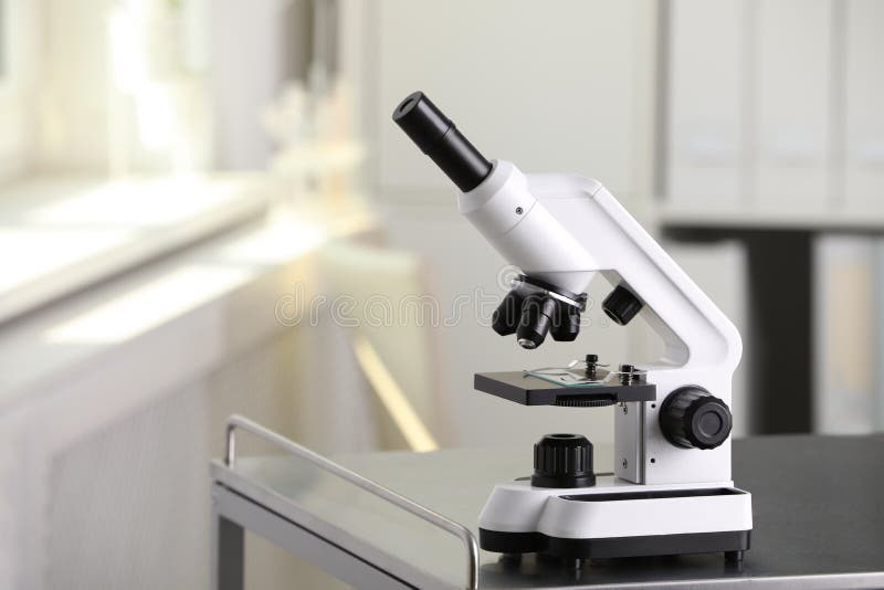 Modern Medical Microscope on Metal Table in Laboratory, Space for Text ...