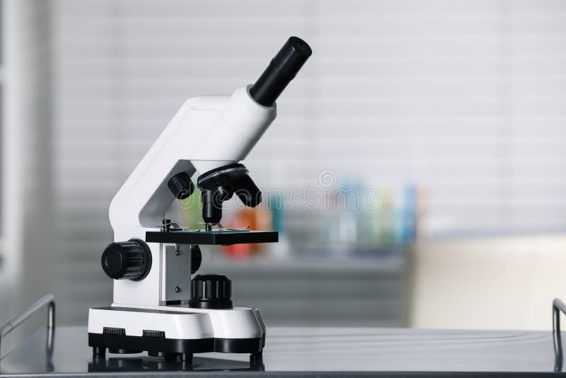 Modern Medical Microscope on Metal Table in Laboratory, Space for Text ...