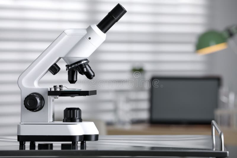 Modern Medical Microscope on Metal Table in Laboratory, Space for Text ...