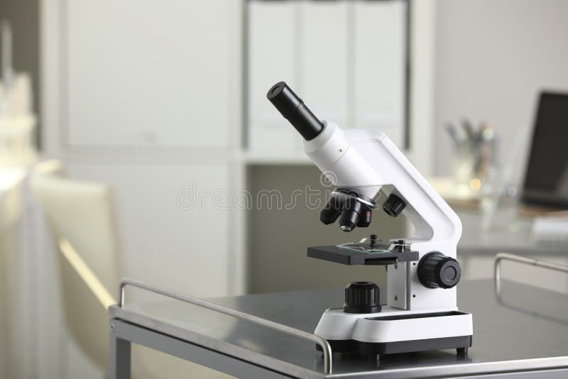 Modern Medical Microscope on Metal Table in Laboratory, Space for Text ...