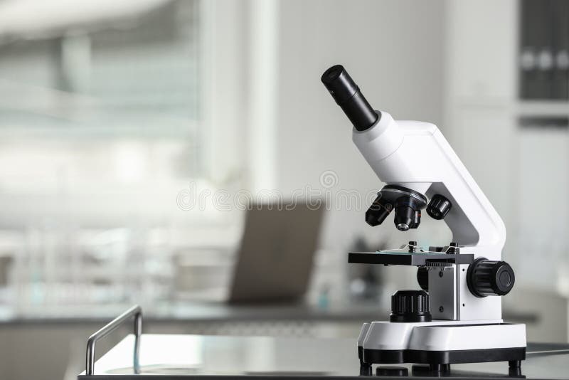 Modern Medical Microscope on Metal Table in Laboratory, Space for Text ...
