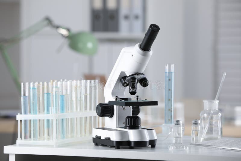 Modern Medical Microscope on White Table in Laboratory Stock Image ...