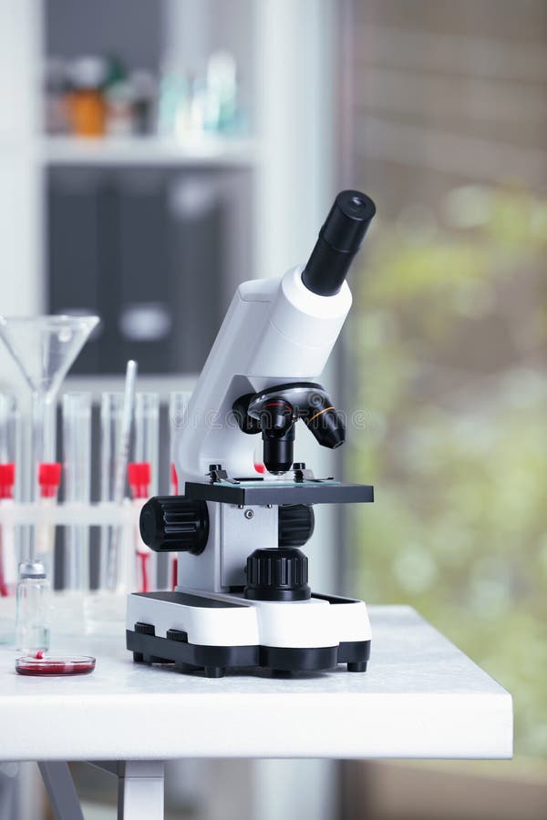 Modern Medical Microscope on White Table in Laboratory Stock Image ...