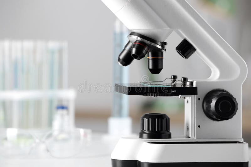Modern Medical Microscope on White Table in Laboratory, Closeup. Space ...