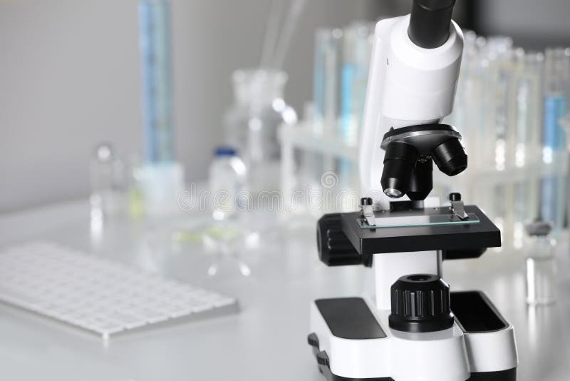 Modern Medical Microscope on White Table in Laboratory, Closeup. Space ...