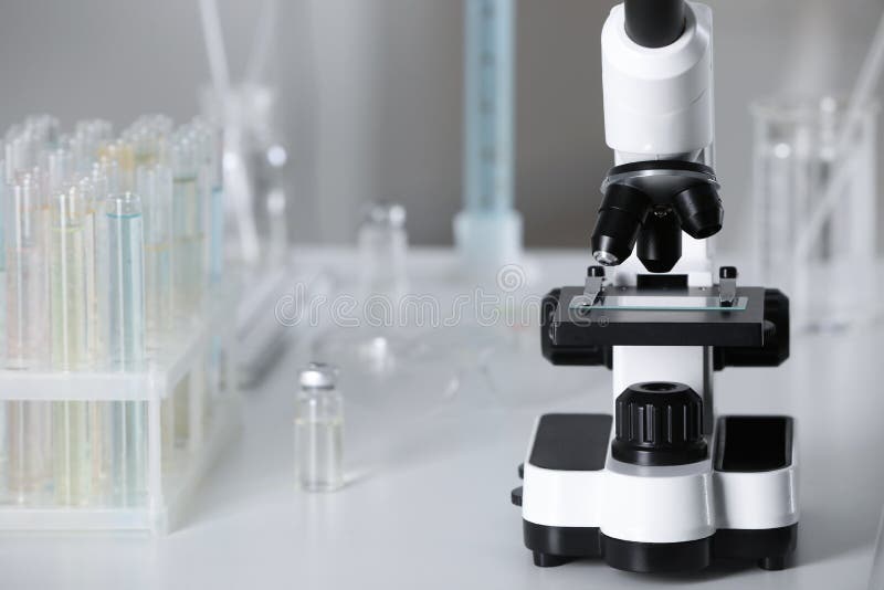 Modern Medical Microscope on White Table in Laboratory, Closeup. Space ...