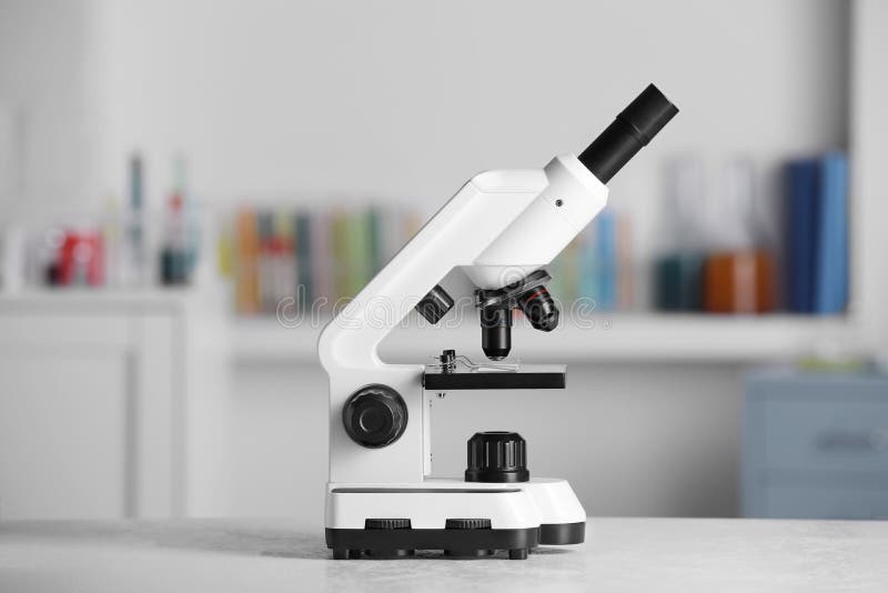 Modern Medical Microscope on White Table in Laboratory Stock Image ...