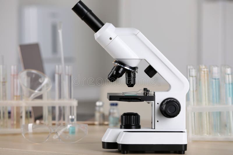 Modern Medical Microscope on Wooden Table in Laboratory Stock Photo ...