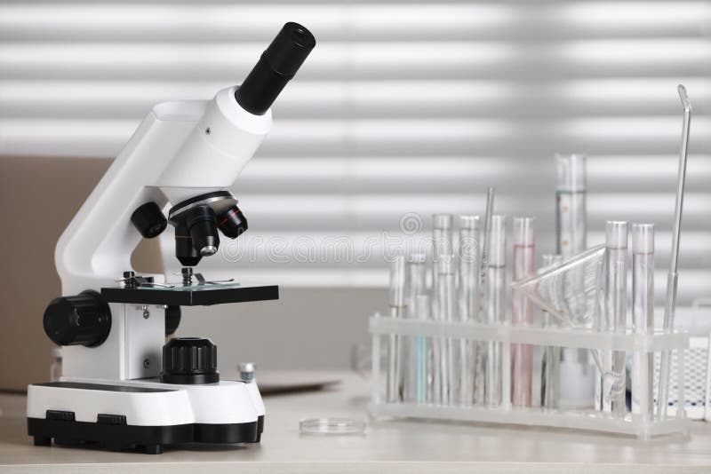 Modern Medical Microscope on Wooden Table in Laboratory, Space for Text ...