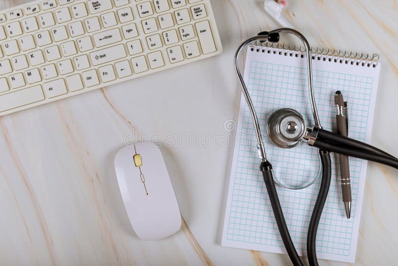 Modern Medical Office Working with Computer Keyboard on Stethoscope ...