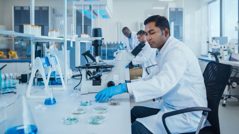 Modern Medical Research Laboratory: Diverse Team of Scientists Working ...